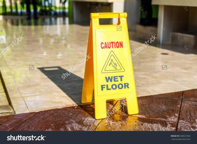 stock-photo-sign-showing-warning-of-caution-wet-floor-on-wet-tile-floor ...